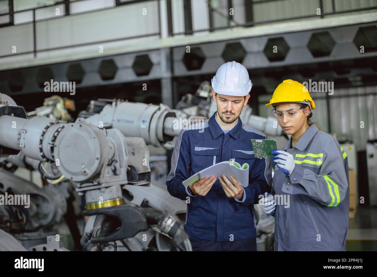 Engineer woman team worker work in Machine Robotic modern Automation ...