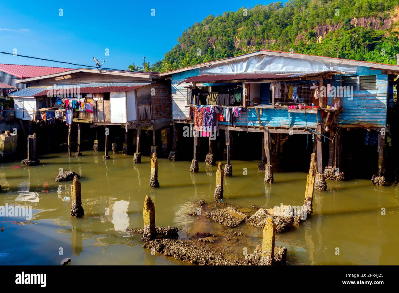 Jetty in Sandakan fishing village, Sabah, Borneo, Malaysia Stock Photo ...