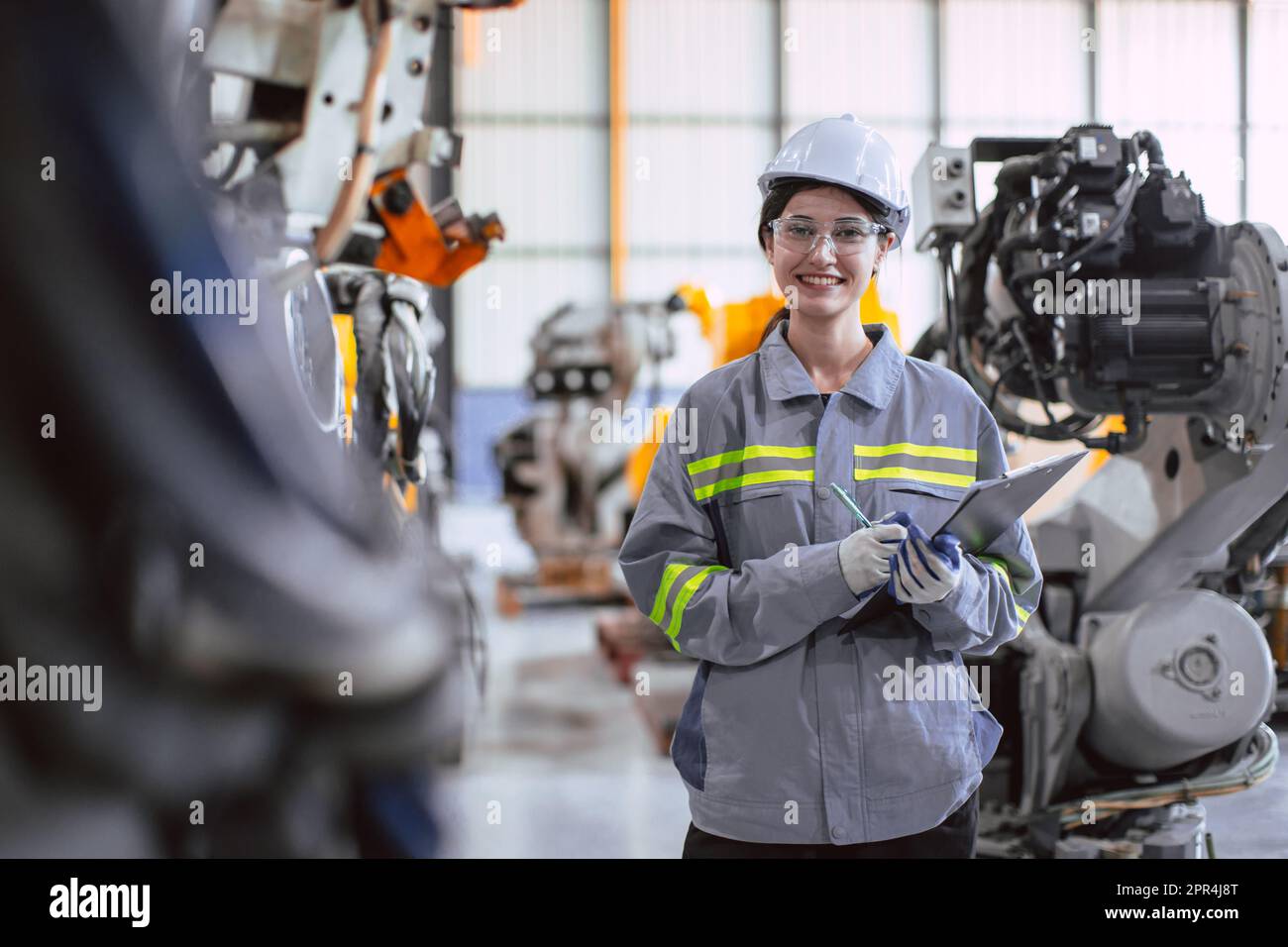 Engineer woman team worker work in Machine Robotic modern Automation ...