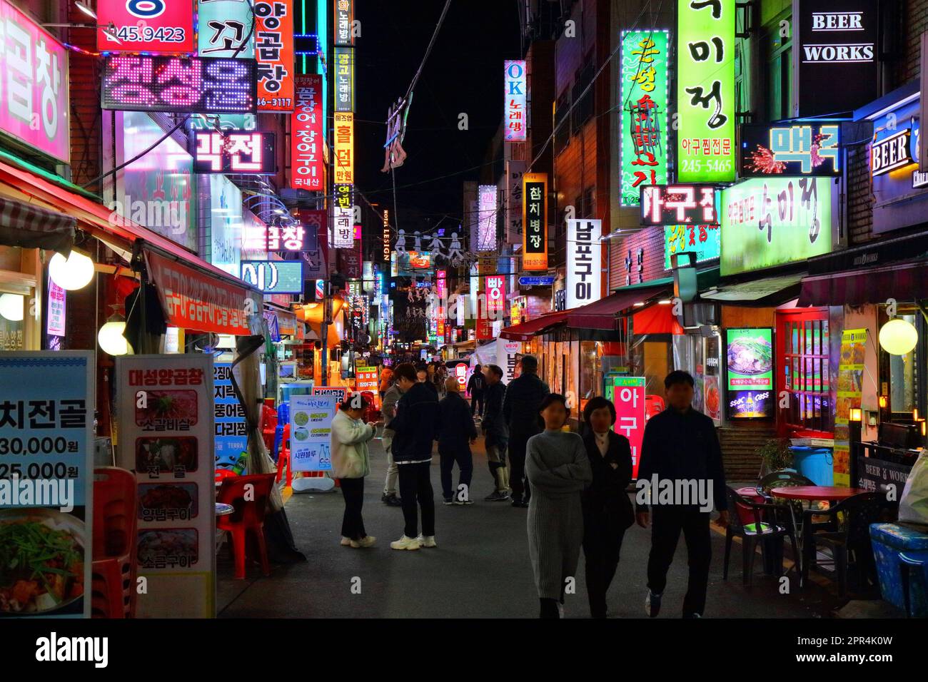 BUSAN, SOUTH KOREA - MARCH 27, 2023: People visit night streets of ...