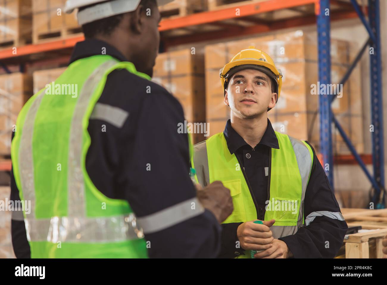Staff worker friends relax enjoy talking together work in warehouse ...
