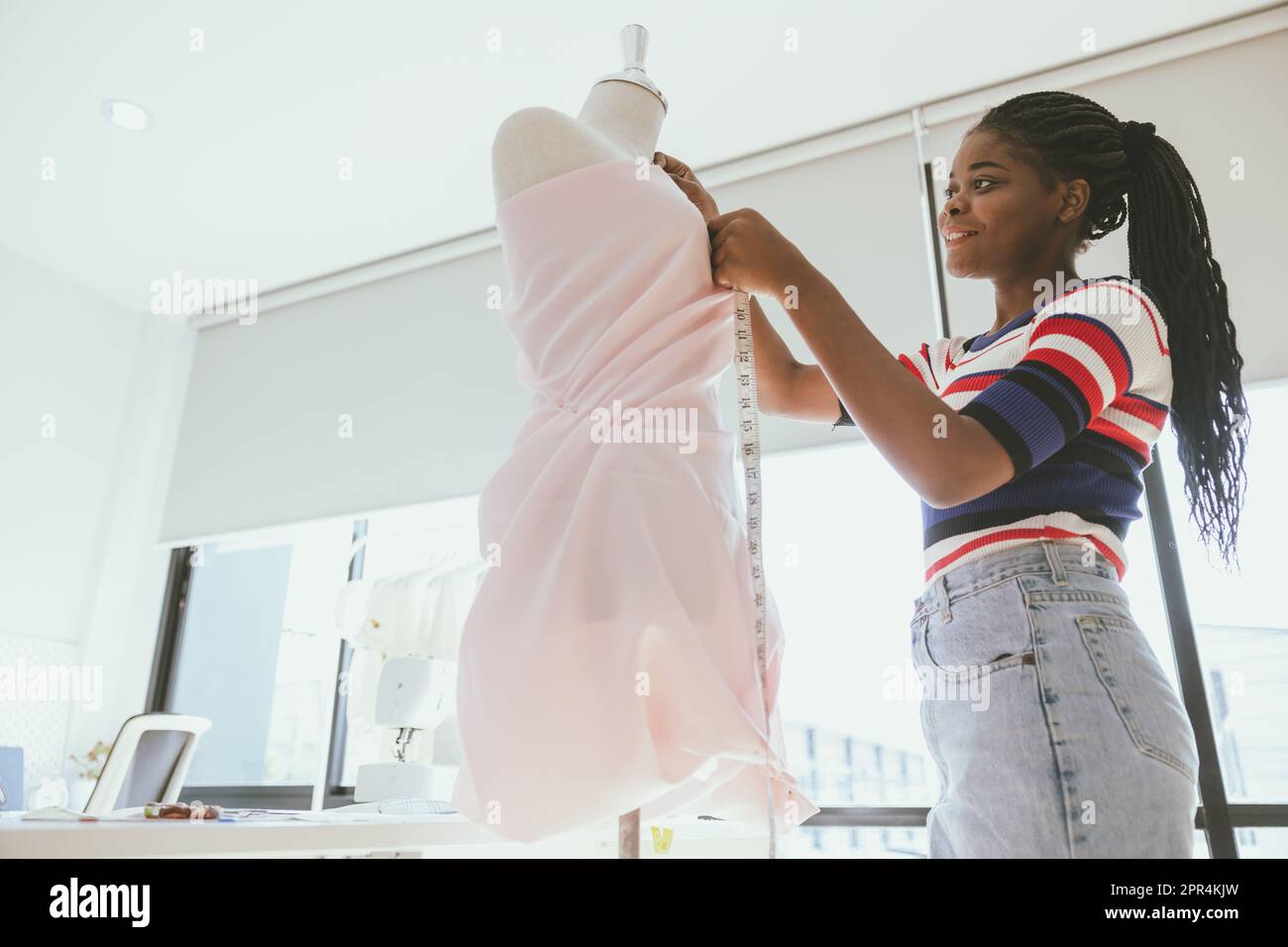 Happy African black woman working as Tailor Clothes Designer enjoy ...