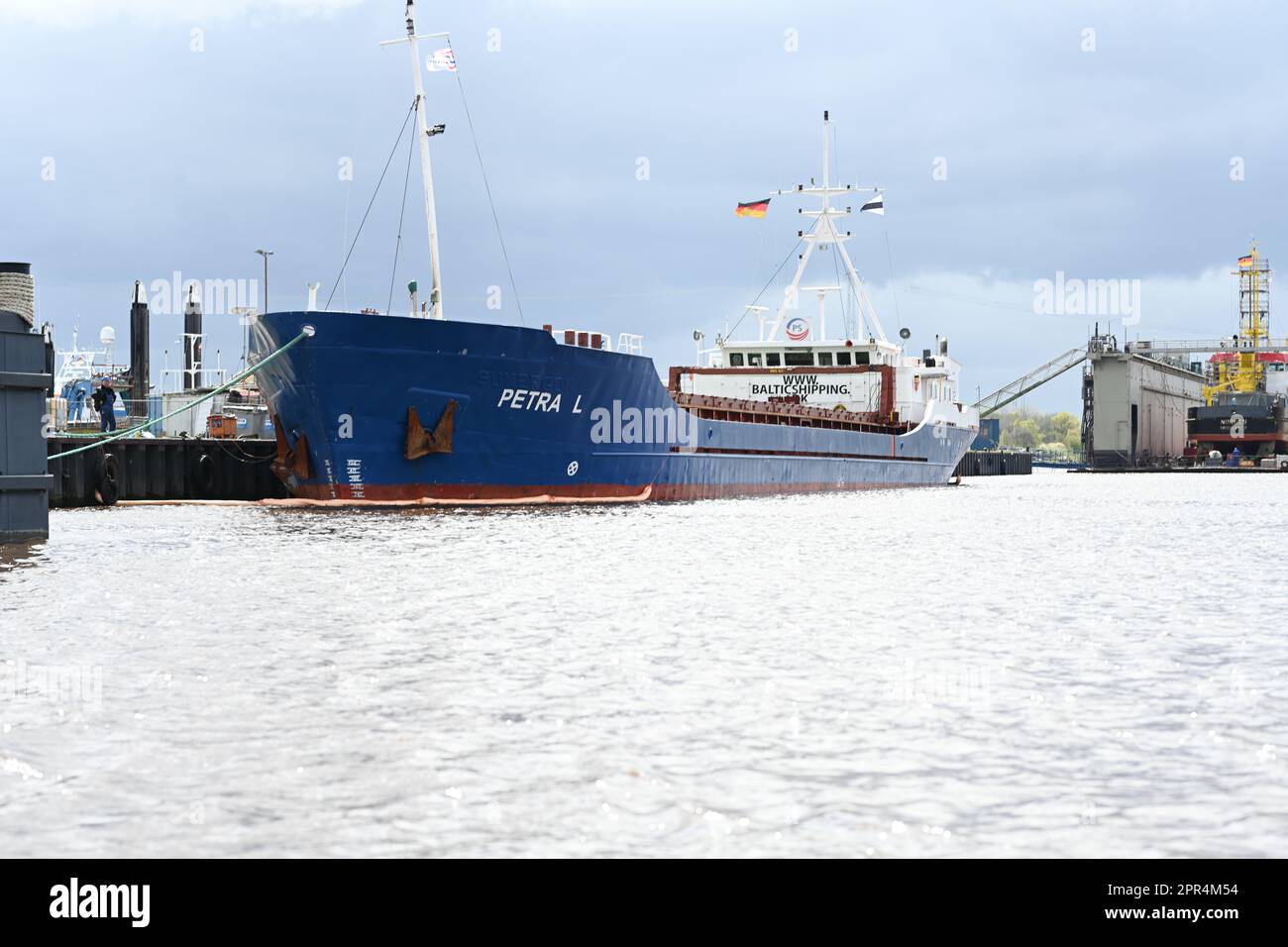Emden, Germany. 26th Apr, 2023. The heavily damaged coaster lies in ...