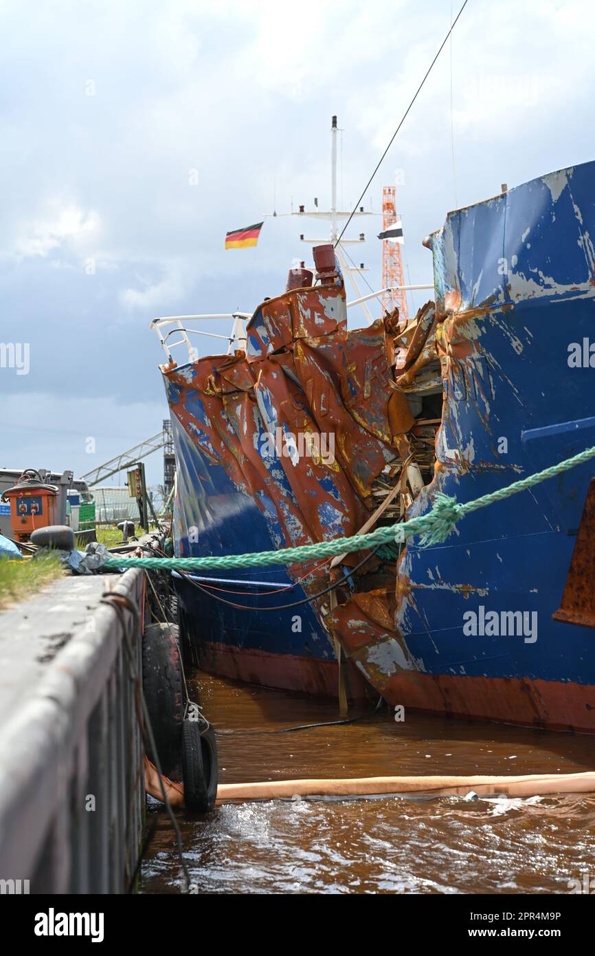 Emden, Germany. 26th Apr, 2023. The heavily damaged coaster lies in ...