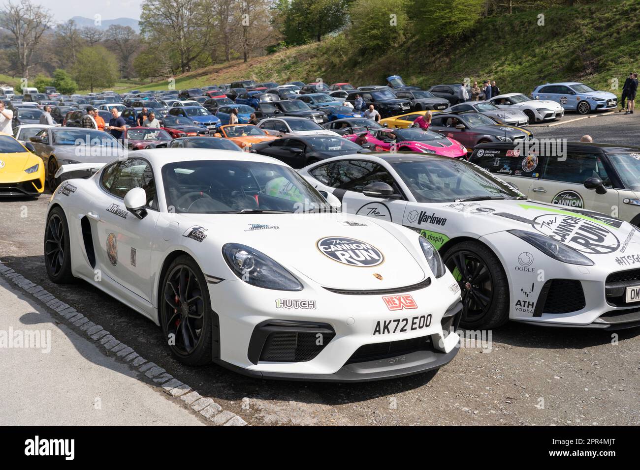 White Porsche 718 Cayman GT4 together with other cars on the UK Cannon ...