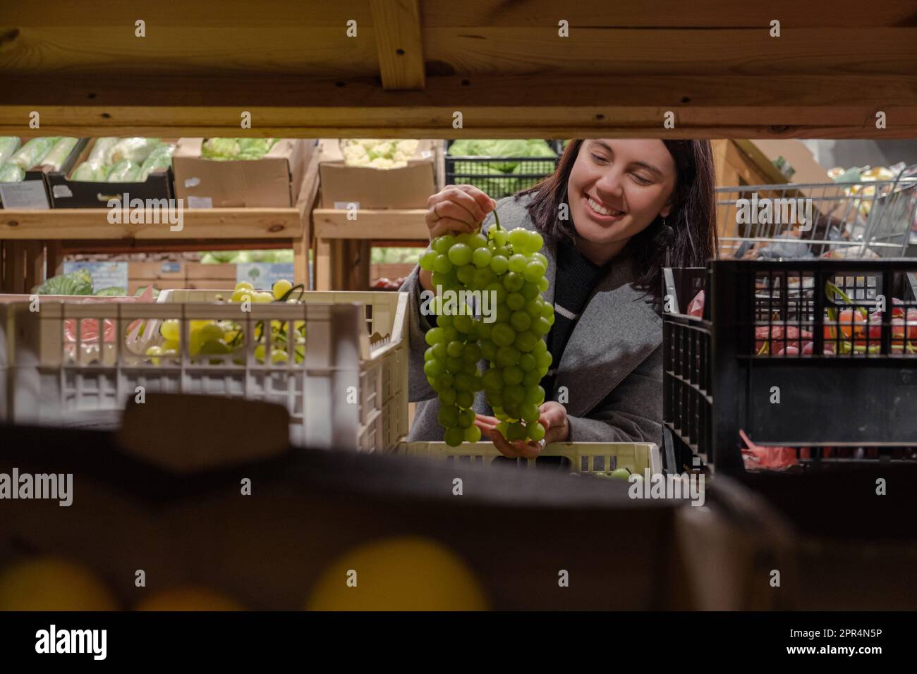 Woman showing grapes in hi-res stock photography and images - Alamy