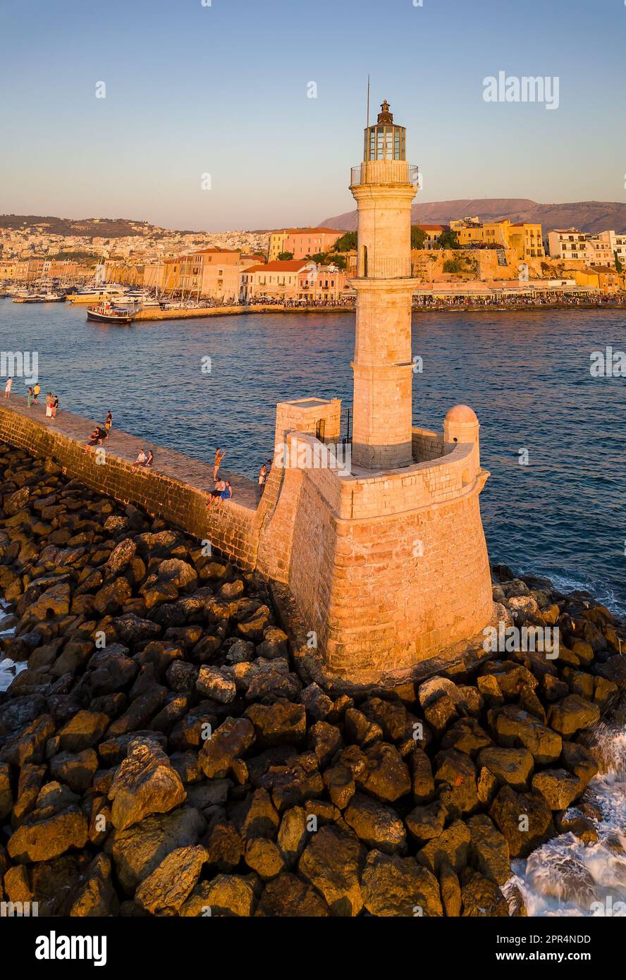Venetian lighthouse in the harbor of Chania (Crete, Greece) bathed in ...