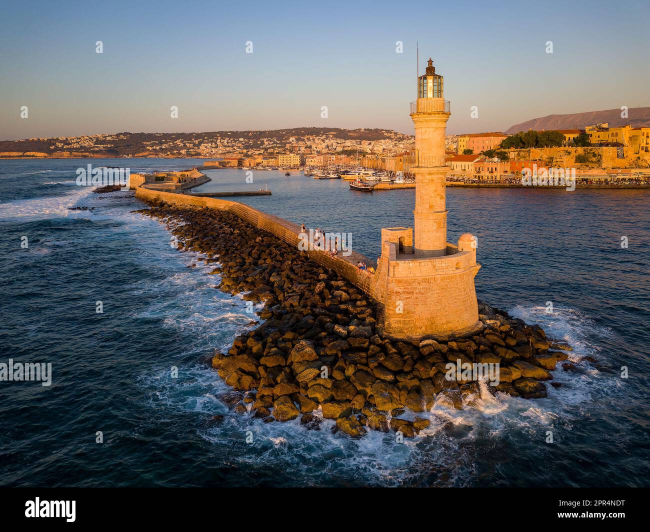 Venetian lighthouse in the harbor of Chania (Crete, Greece) bathed in ...
