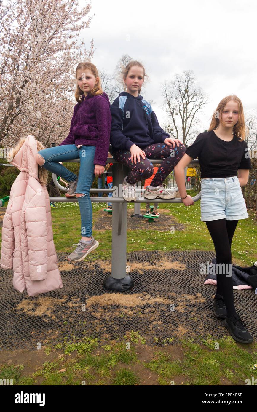 Three sisters, aged eight years, 13 years, and 11 years, pose for a ...