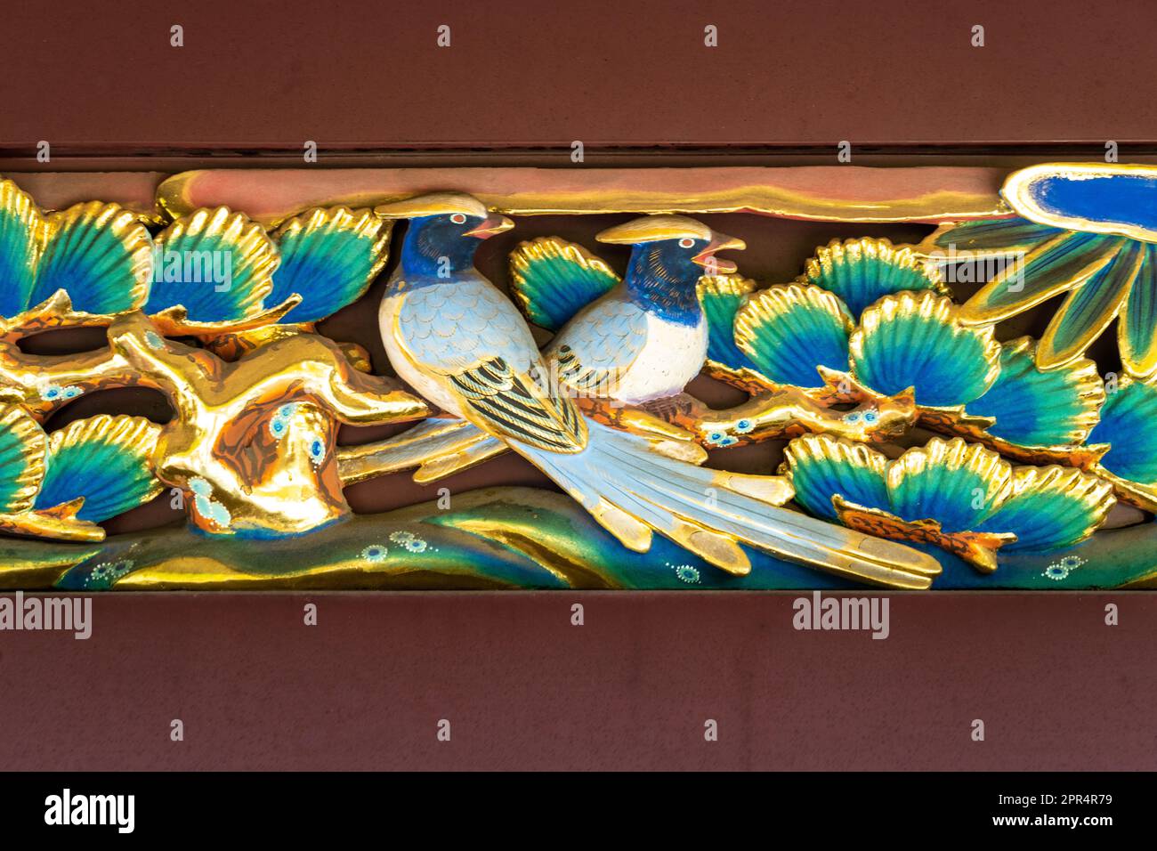 Detail of the extensive wooden carvings of flowers and birds on the ...