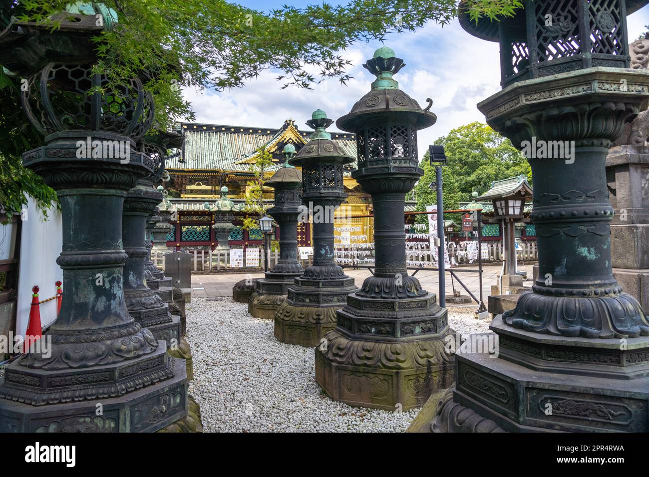 Japanese style stone and cooper lanterns leading to the Ueno Tosho-gu ...
