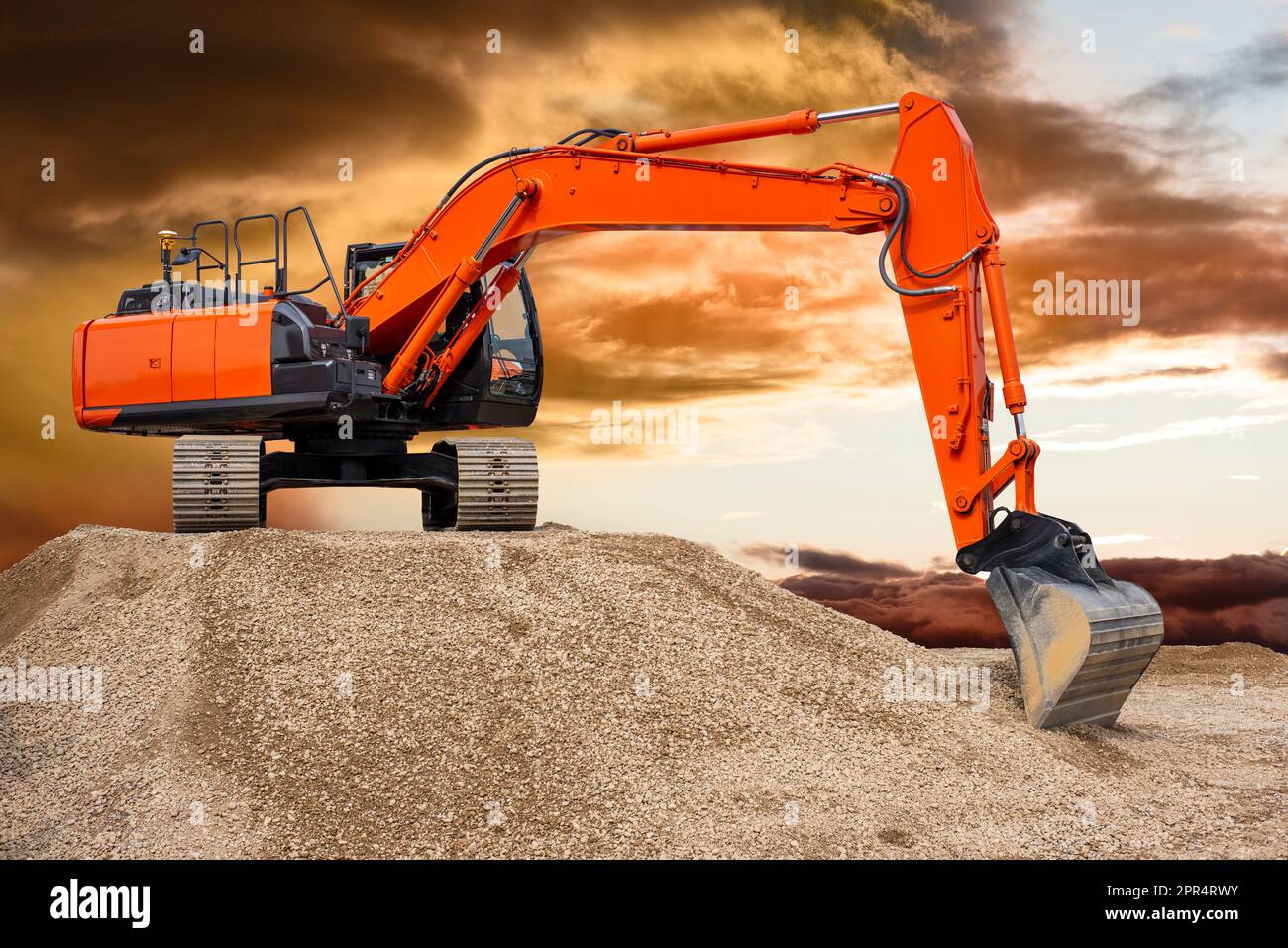 excavator is working and digging at construction site Stock Photo - Alamy