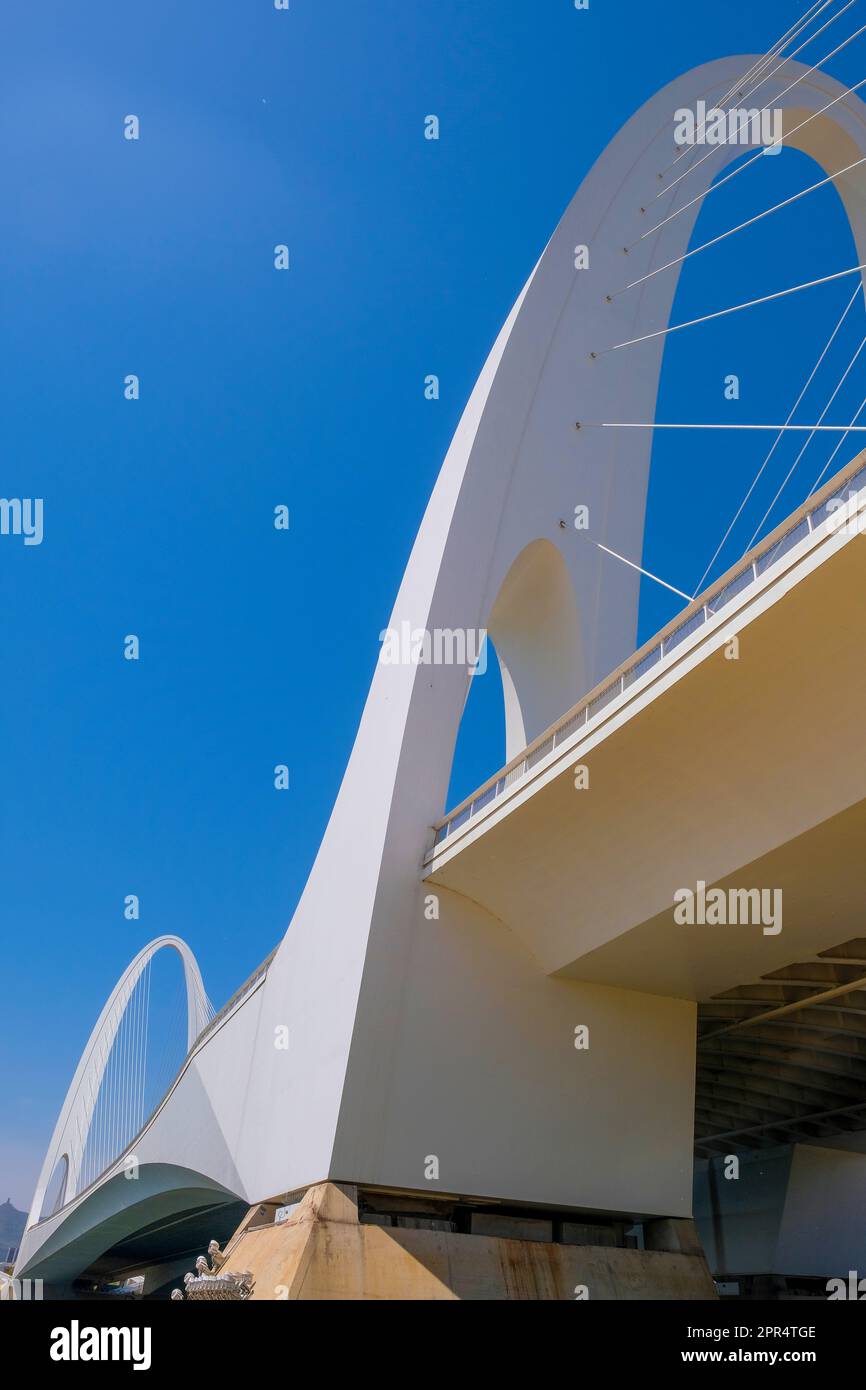 A beautiful stone bridge with two arches on one side and three columns ...