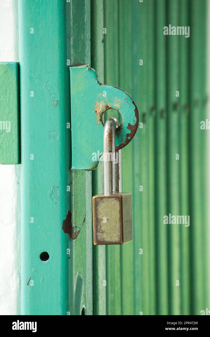 The lock key is on the steel door loop Stock Photo - Alamy