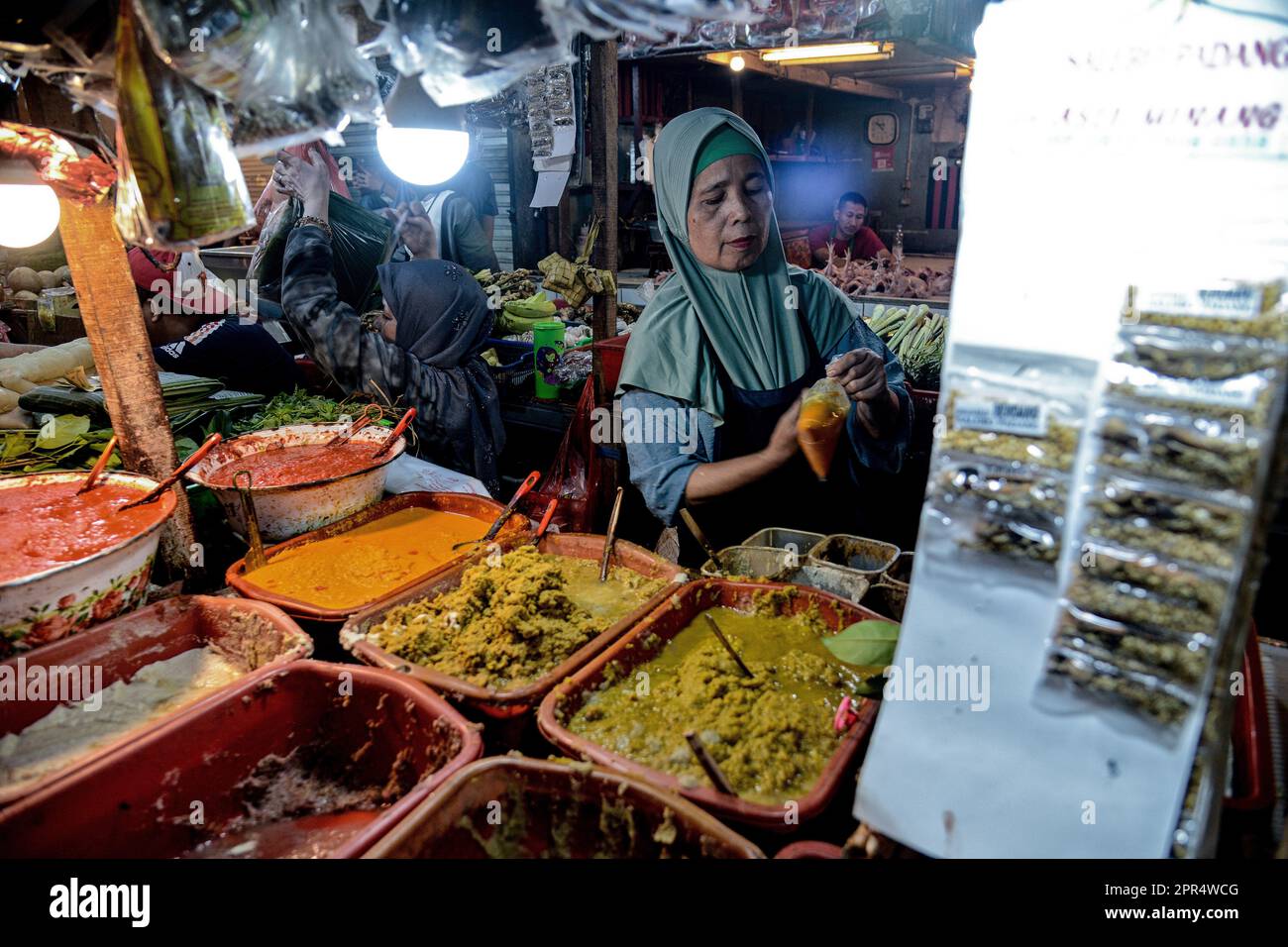 Bogor, West Java, Indonesia. 26th Apr, 2023. A vendor prepares an order of Spices at a stall at ...