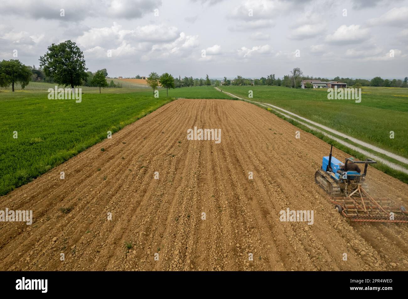 Castell'Arquato, Italy - April 2023 farmer driving crawled tractor in ...