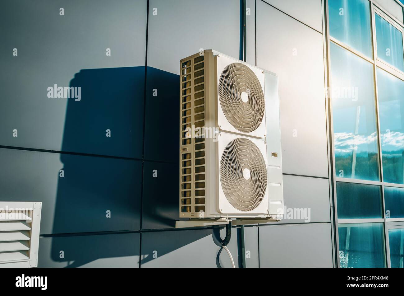 Modern Building Exterior with Air Conditioning. Sun Reflection in ...