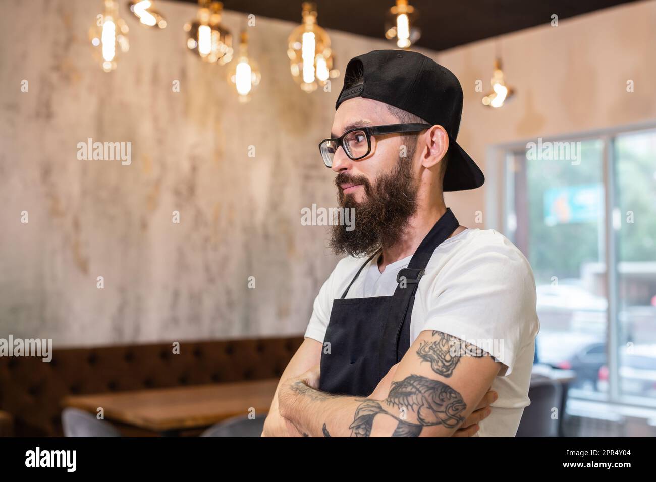 Happy confident young waiter entrepreneur smiling male small cafe ...