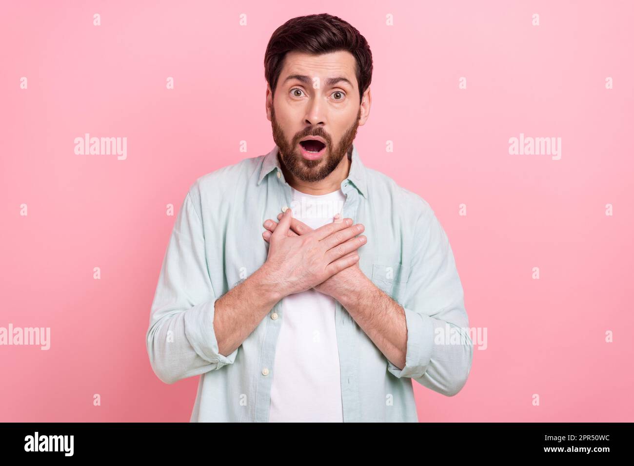 Photo portrait of attractive young man frightened terrified arms touch ...