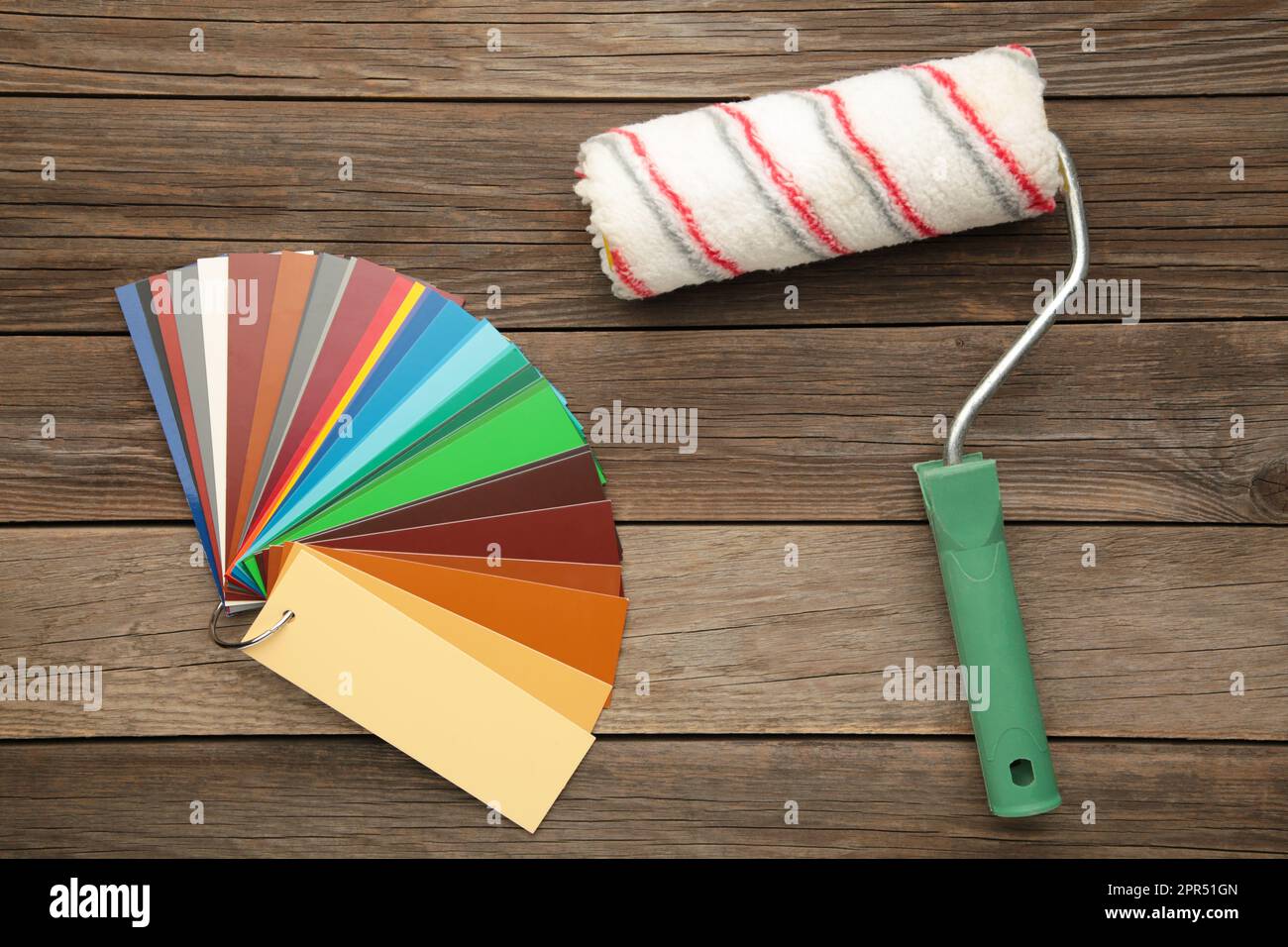 Coloured swatches and paint roller on grey table. Top view Stock Photo ...