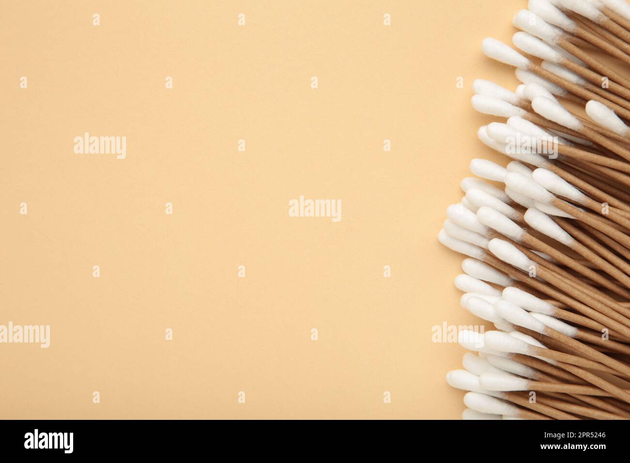 White cotton swabs on beige background with copy space. Top view Stock ...