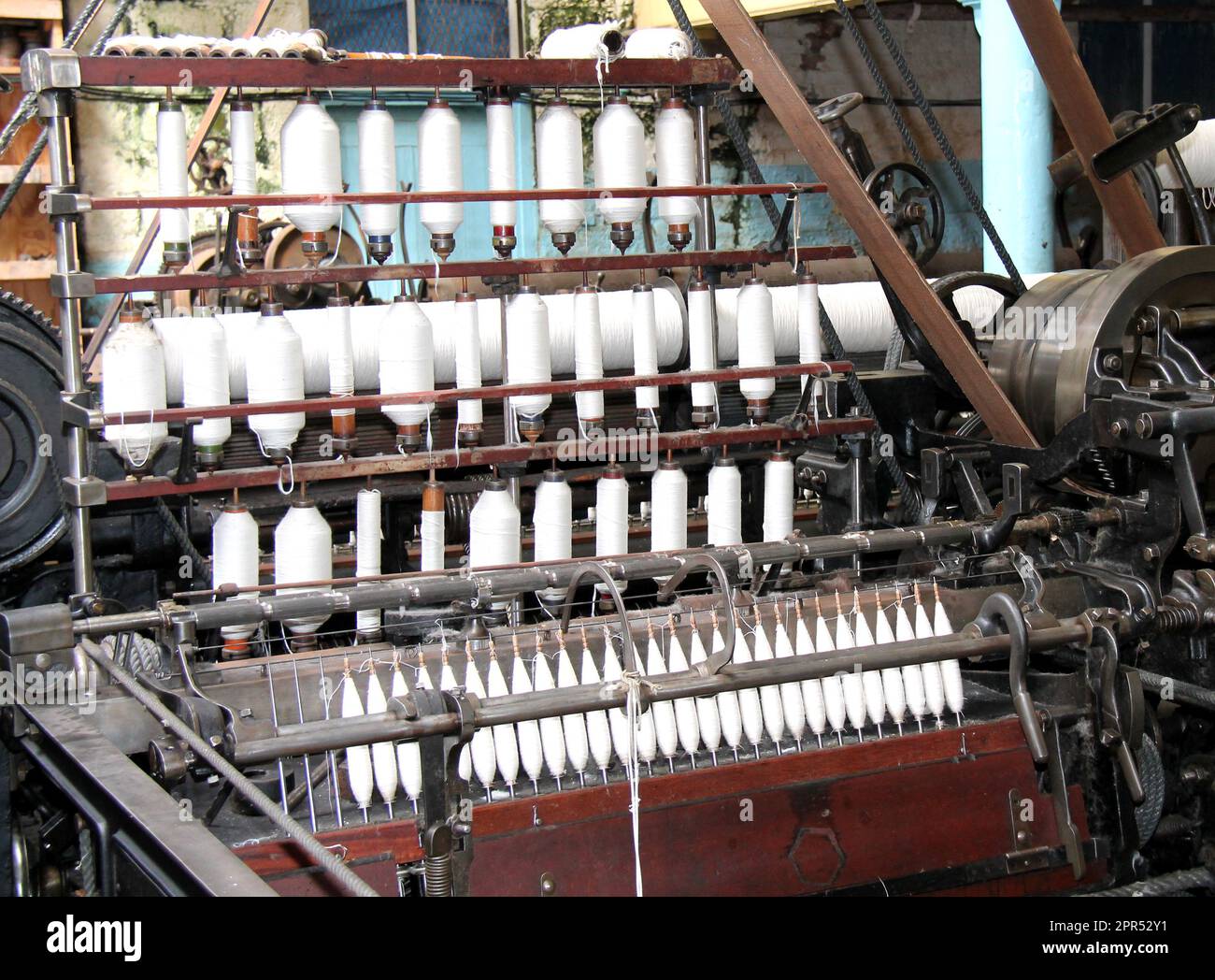 The Spools and Bobbins on a Vintage Textile Machine Stock Photo - Alamy