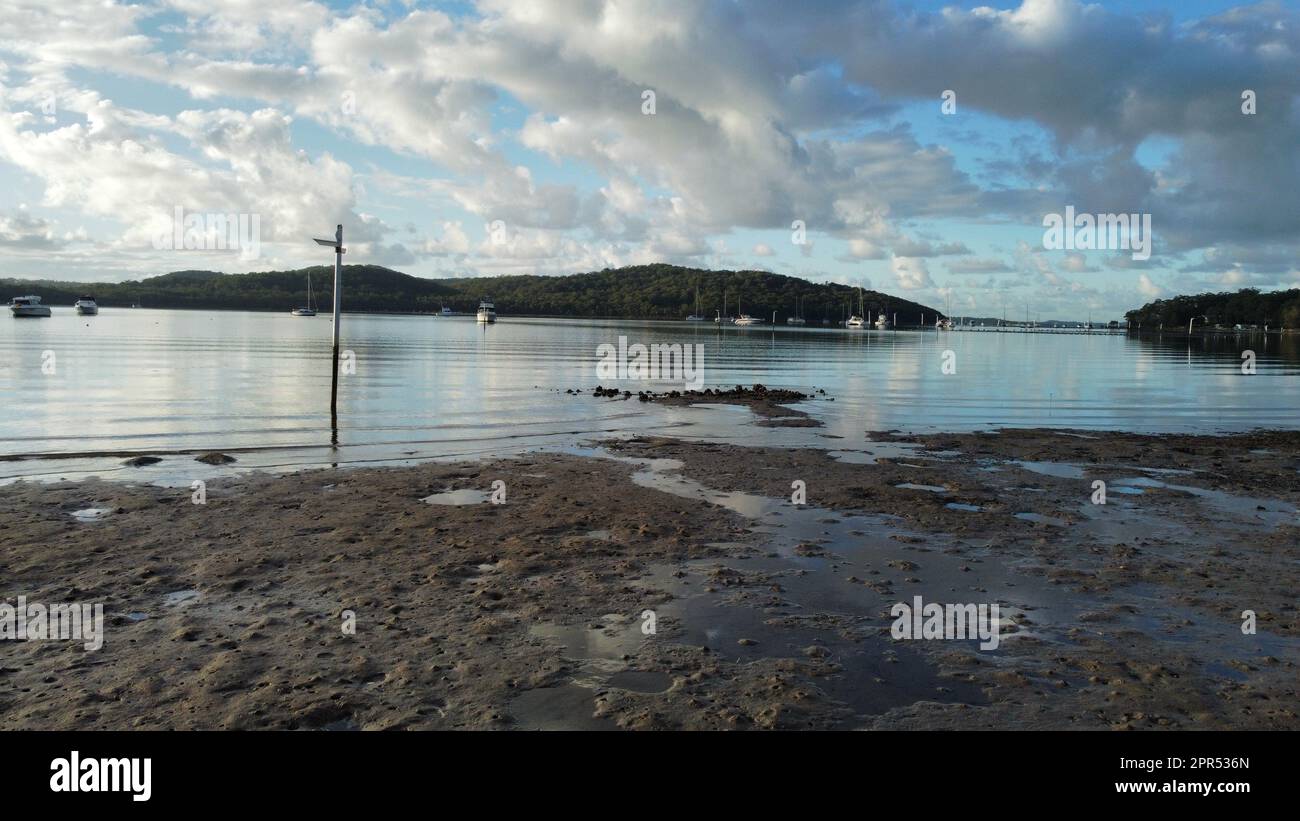 A picturesque beach scene featuring a shoreline of crystal clear water ...