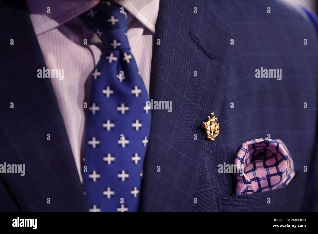King Charles III wears a 'Blue Peter' badge during a visit to the M and ...