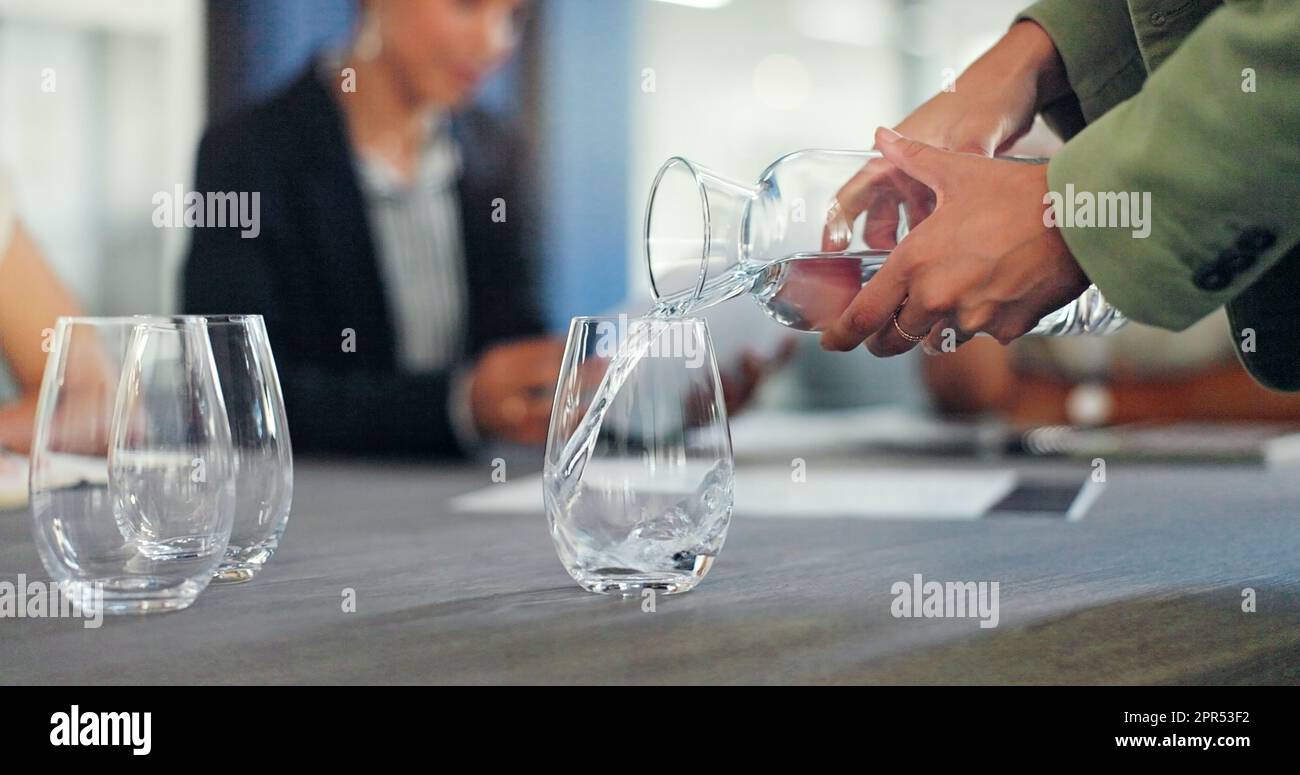 Business staff, hands and pouring water into glass of a employee ready ...
