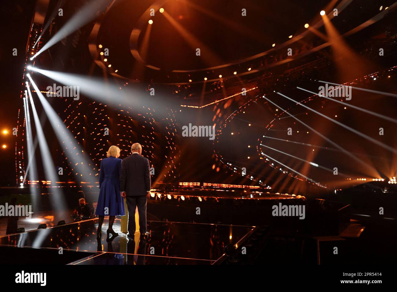 King Charles III and the Queen Consort stand on the stage after ...