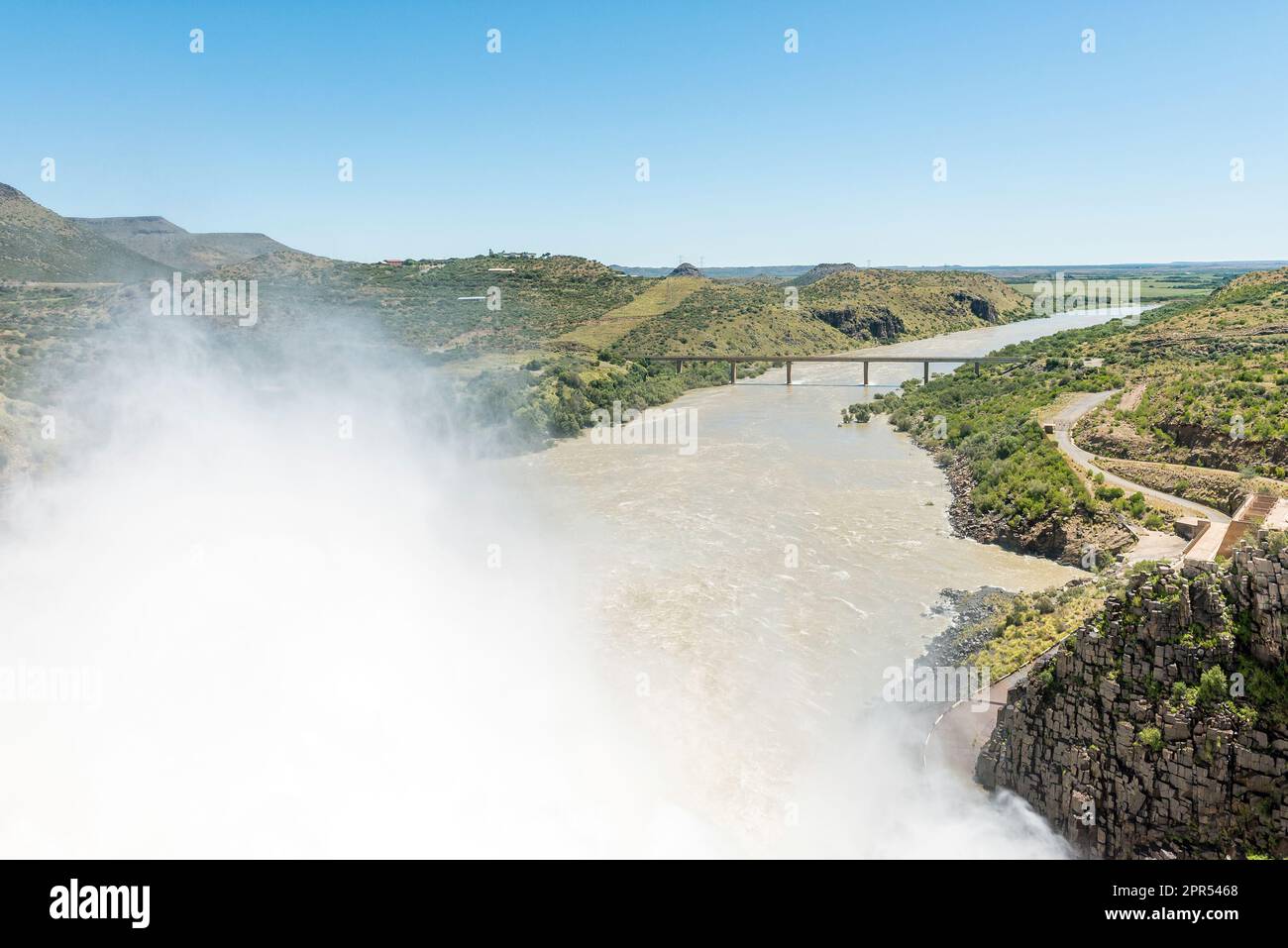 Single lane road bridge over the Orange River below the overflowing ...