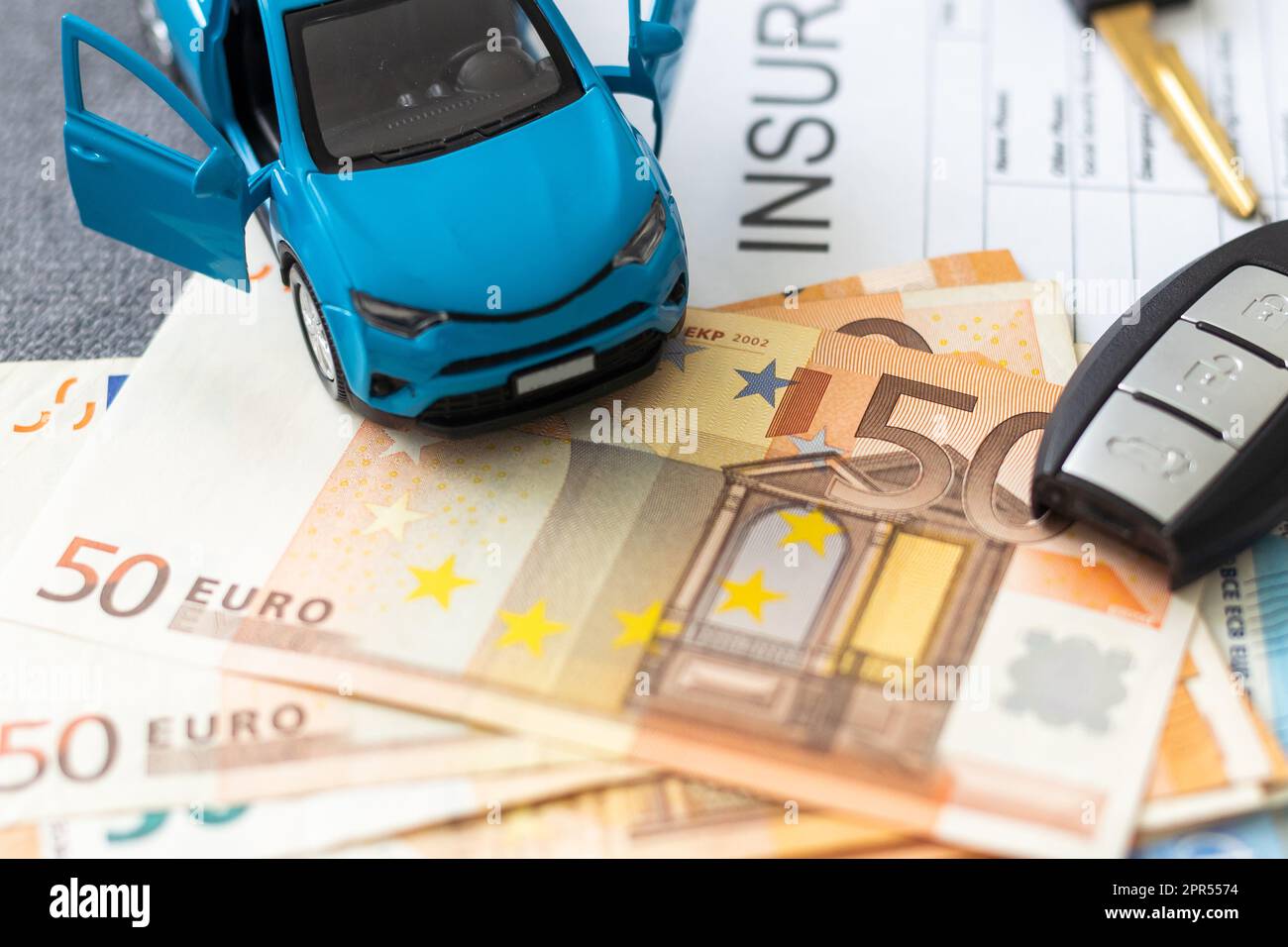 Car insurance form with car key and toy car Stock Photo - Alamy