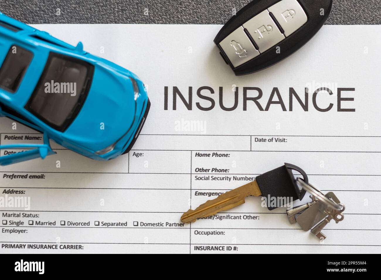 Car insurance form with car key and toy car Stock Photo - Alamy