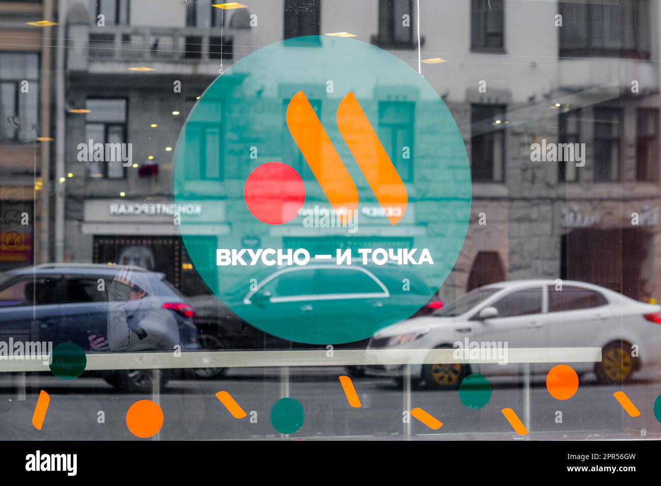 new logo and title fast food McDonalds Restaurant in Russia Vkusno I Tochka in window with city ...