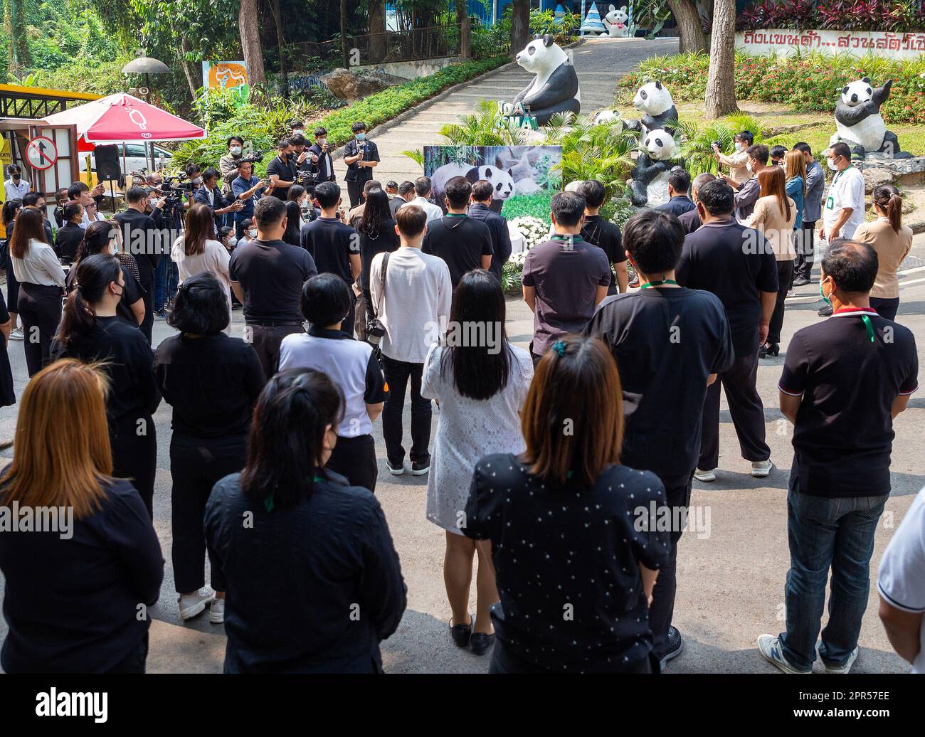 Employees of the Chiang Mai Zoo observe a moment of silence on the ...