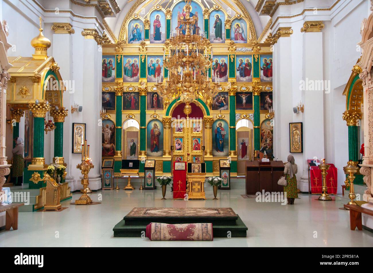 OSTASHKOV, RUSSIA - MAY, 2012: A pilgrim prays in the interior of an ...