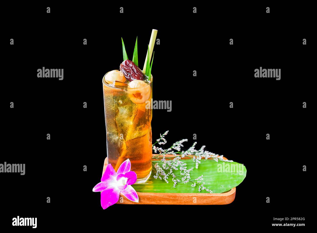 Vietnamese tamarind juice with goji berries isolated on black ...