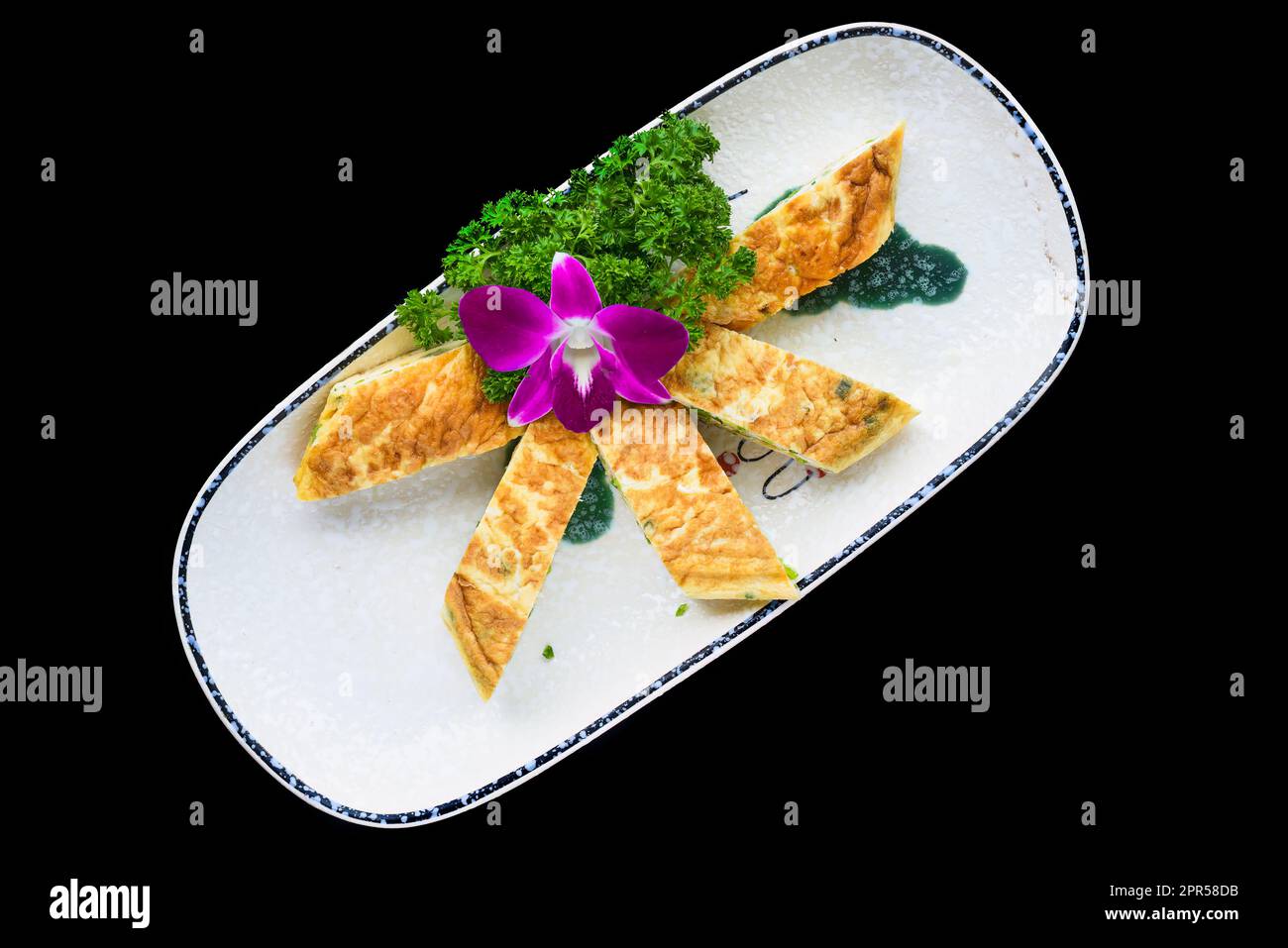 French egg omelette on plate cut on pieces isolated for a menu Stock ...