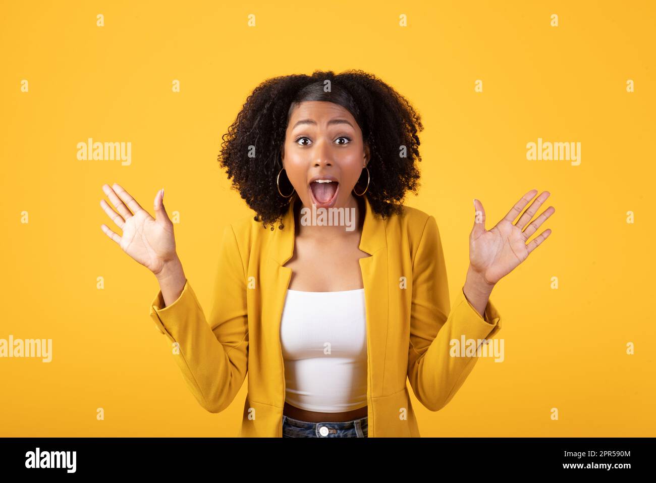 Overjoyed black lady shouting WOW, screaming with joy, excited over ...