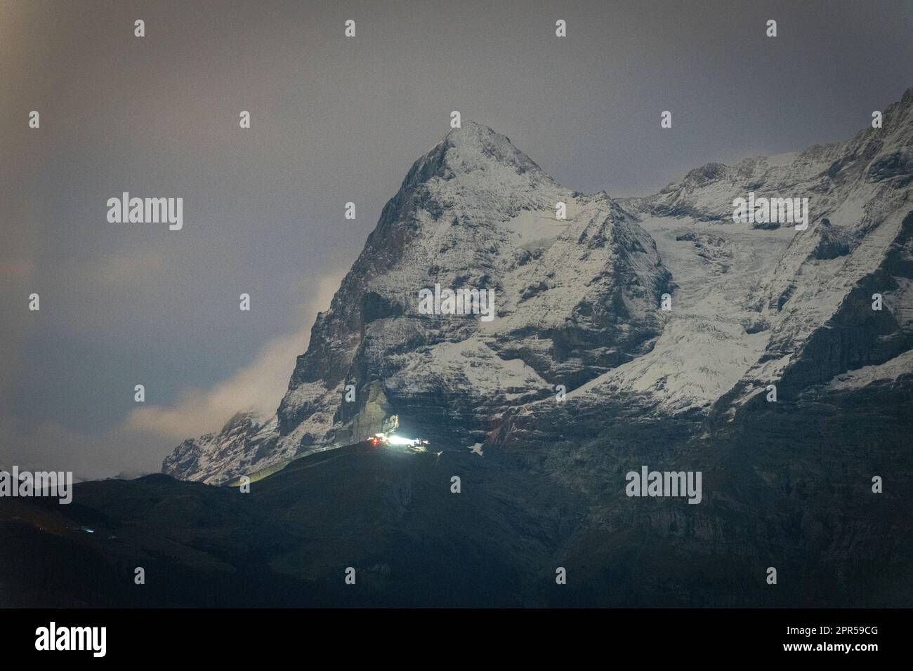 Majestic Mount Eiger above the illuminated Kleine Scheidegg mountain ...