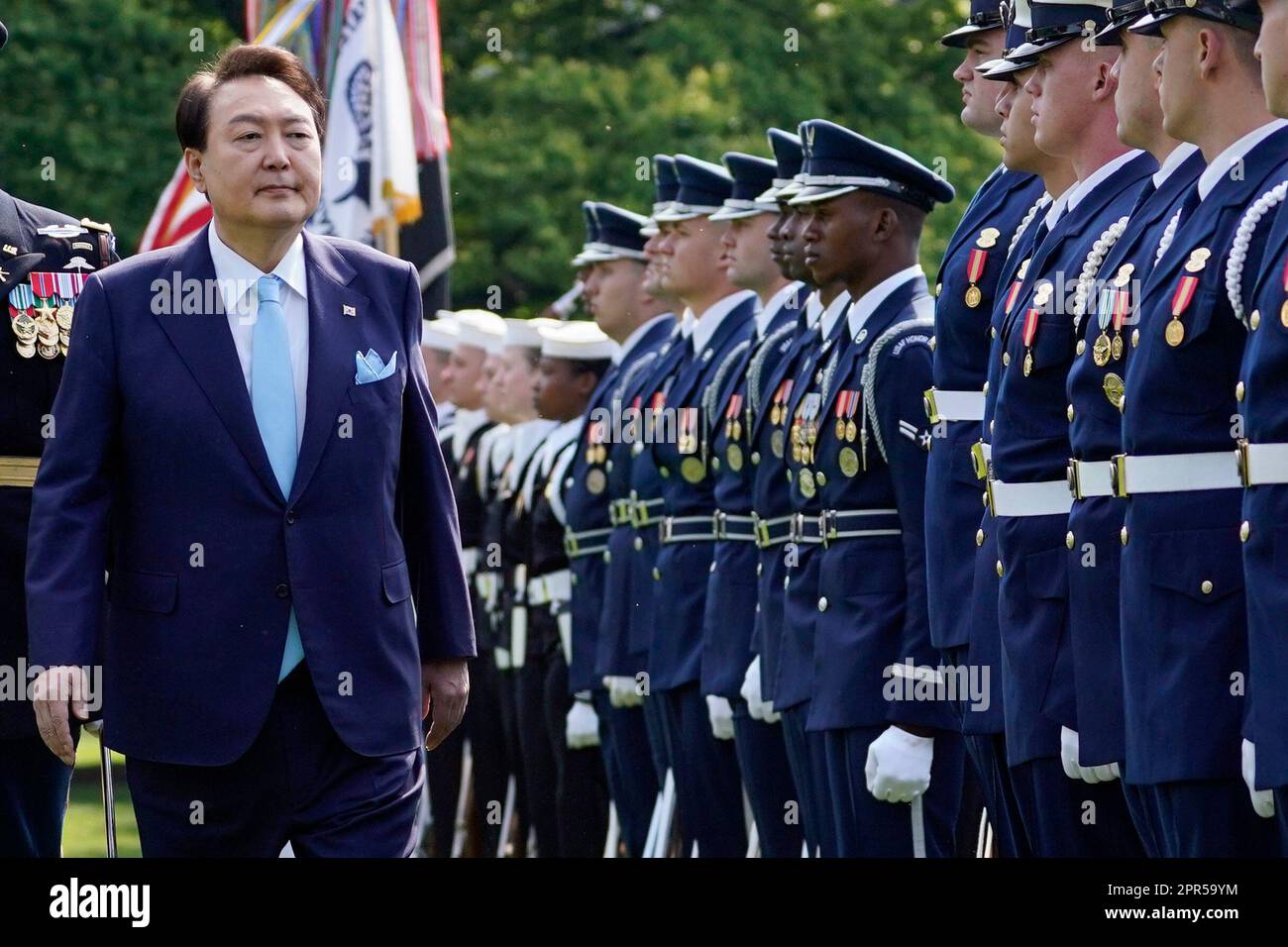 South Korea's President Yoon Suk Yeol reviews the troops with President ...