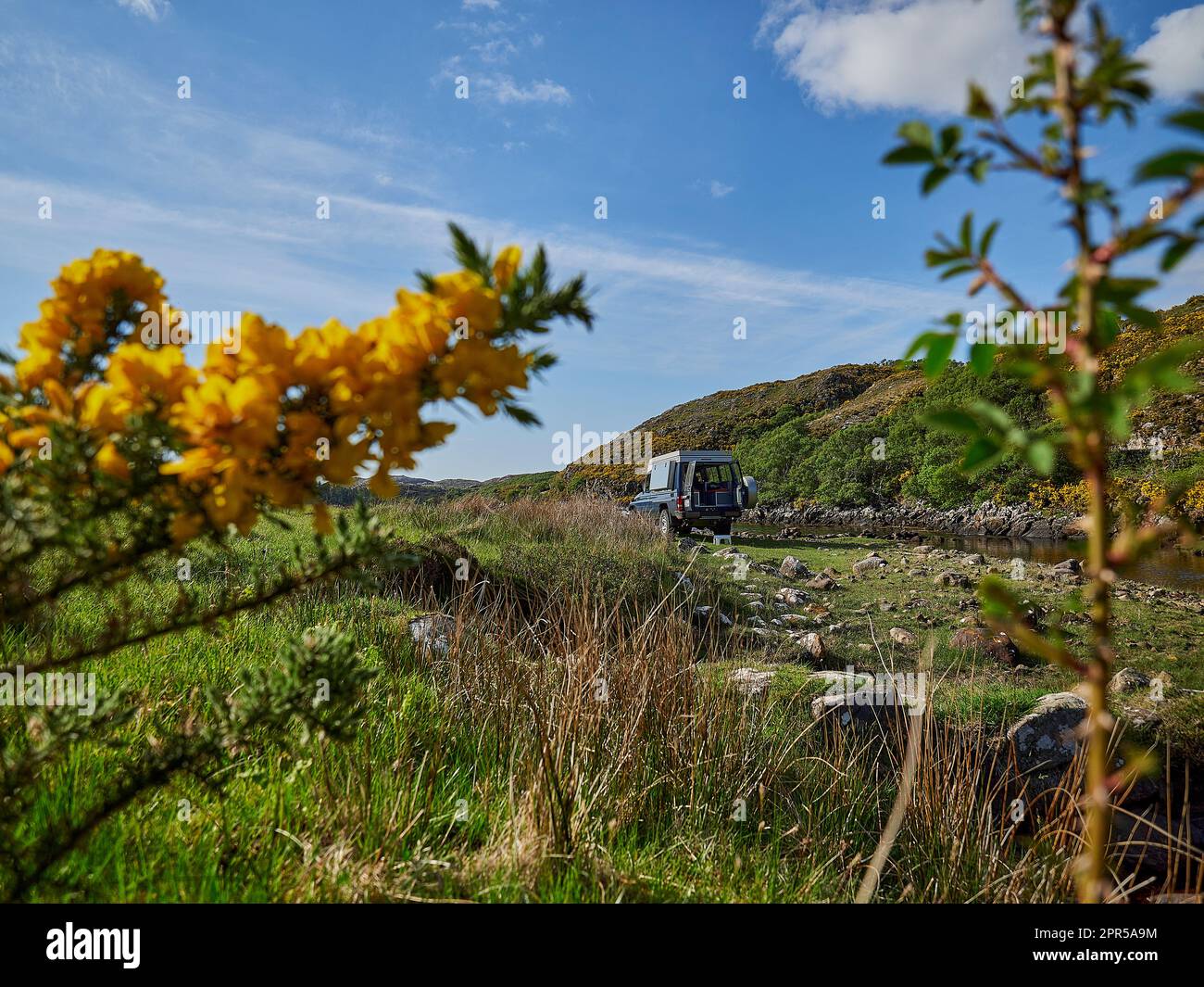 landscape of the northern highlands in Scotland along a small river ...