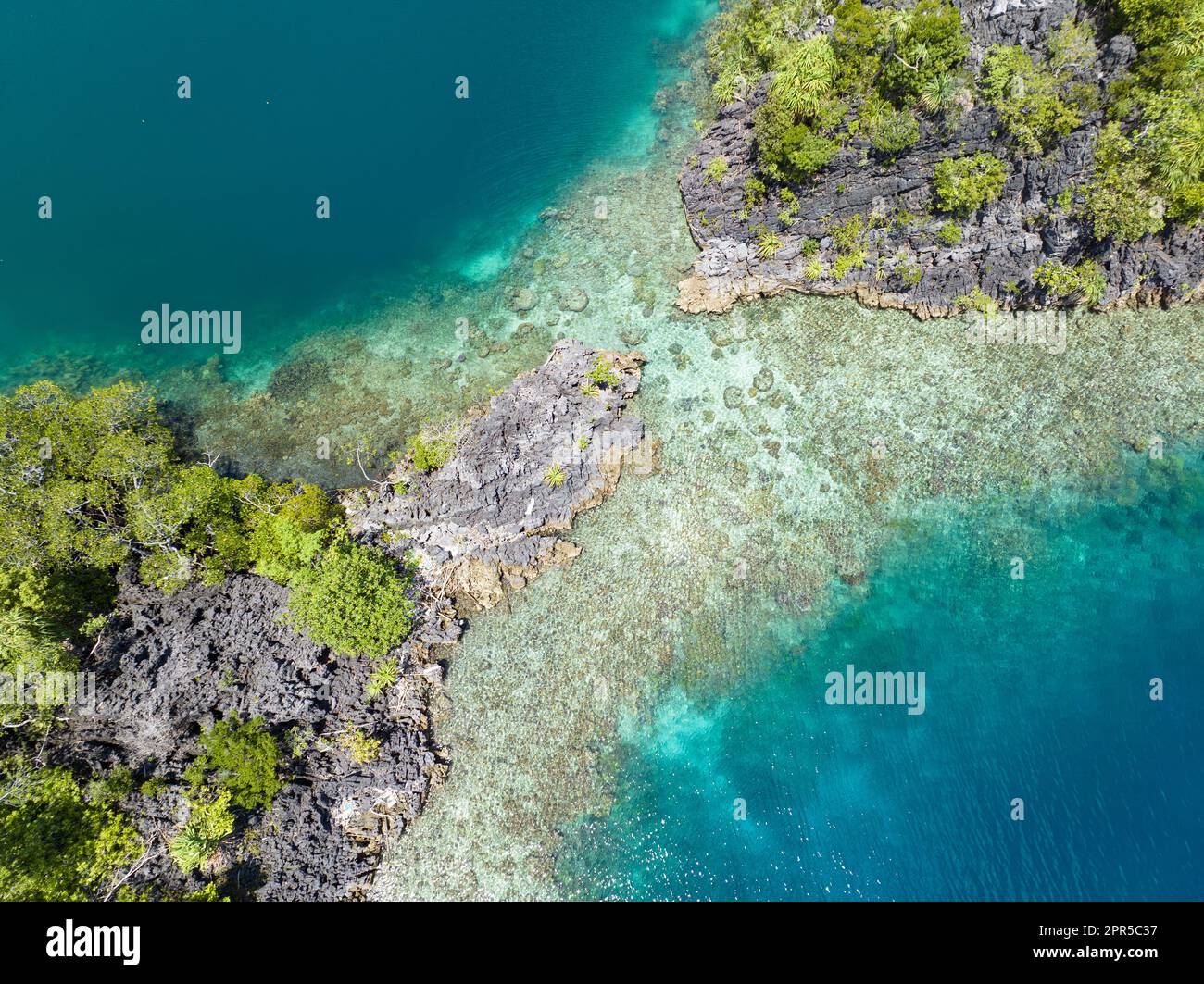 Beautiful and diverse coral reefs surround the dramatic limestone ...