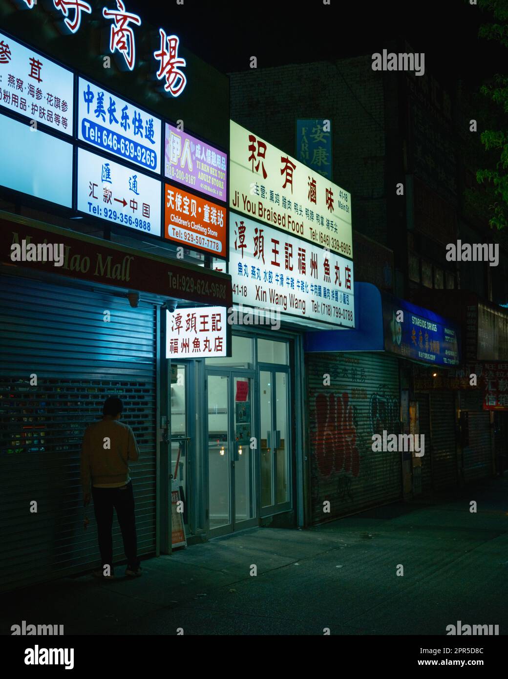 Signs at night in Flushing, Queens, New York Stock Photo - Alamy