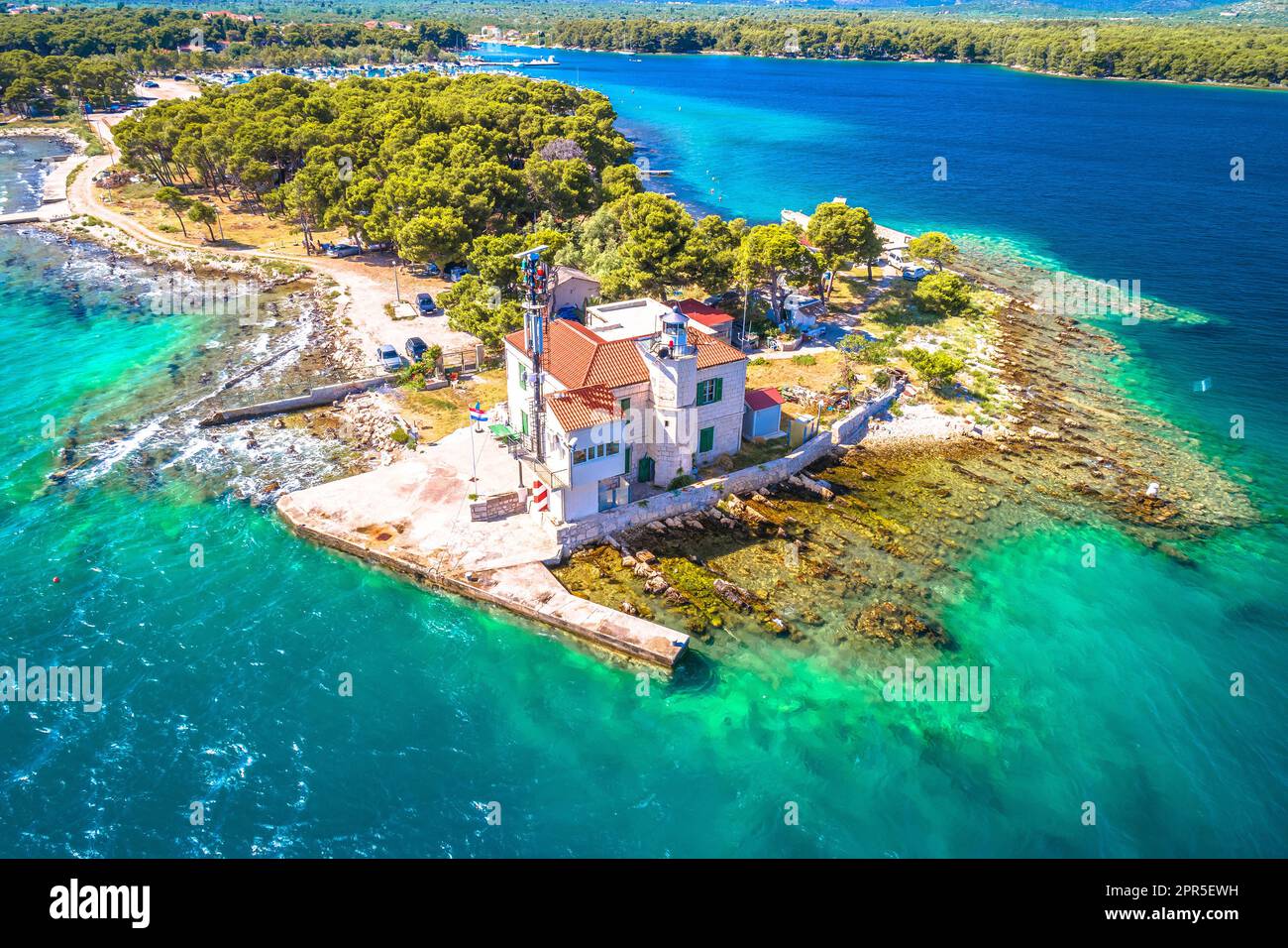 Jadrija lighthouse and beach in Sibenik bay entrance aerial view ...