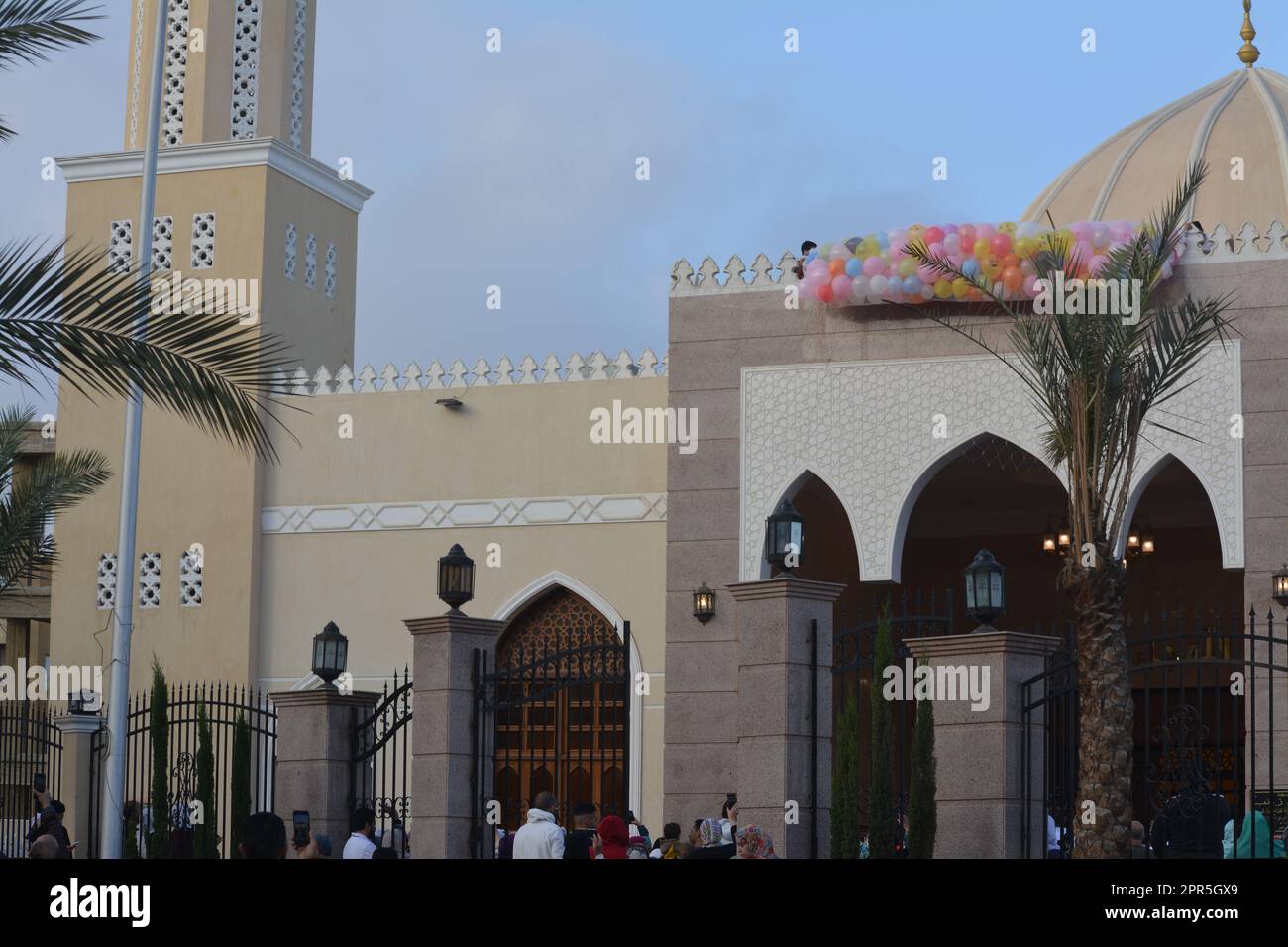 Cairo, Egypt, April 21 2023: Throwing balloons for kids and children after Eid El Fetr Islamic ...