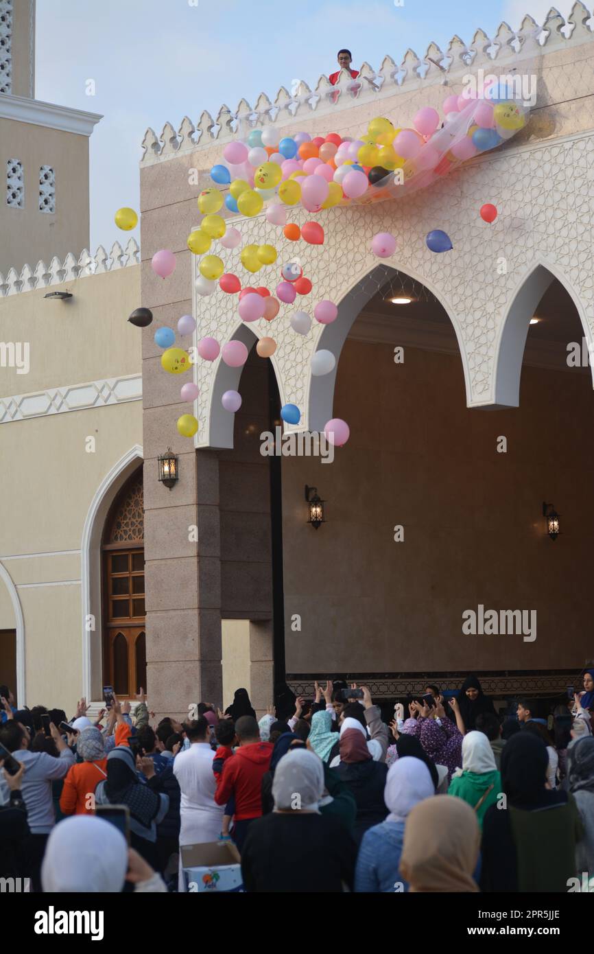 Cairo, Egypt, April 21 2023: Throwing balloons for kids and children ...