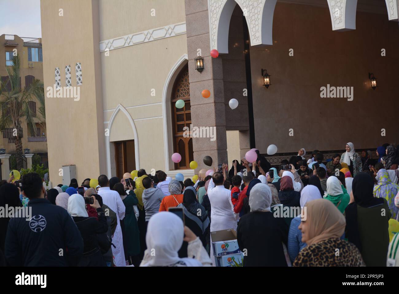 Cairo, Egypt, April 21 2023: Throwing balloons for kids and children ...