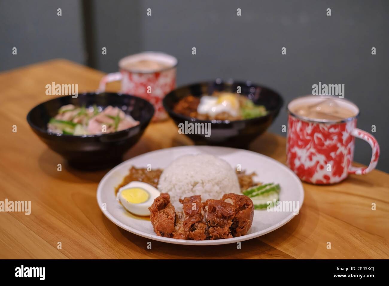 A set of Malaysian cuisine contained Steamed Chicken Rice, Nasi Lemak ...