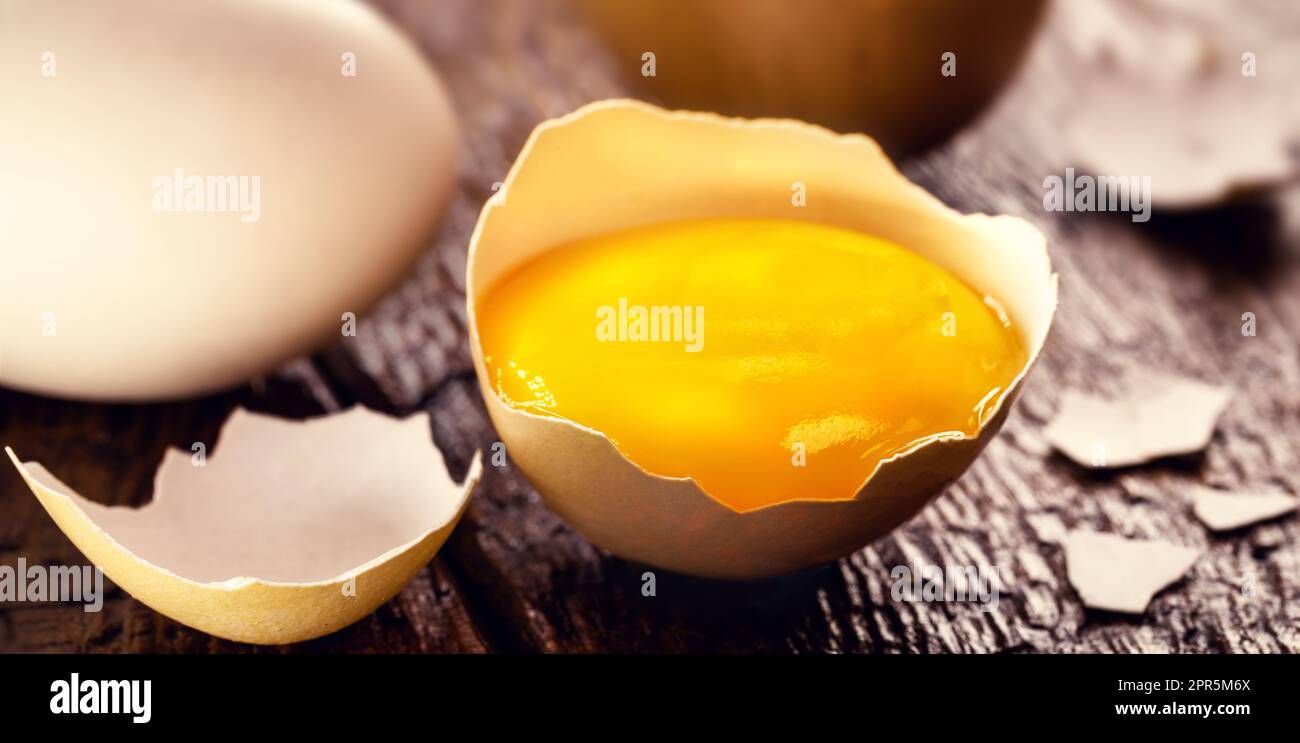 egg broken in half with sample yolk, yellow yolk, from Brazilian ...